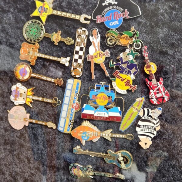 e148- large collection of Hard Rock Cafe pins arranged in the shape of ...