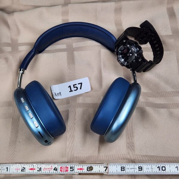 c157- Headphones, no charger. Casio watch - Leftover Treasures