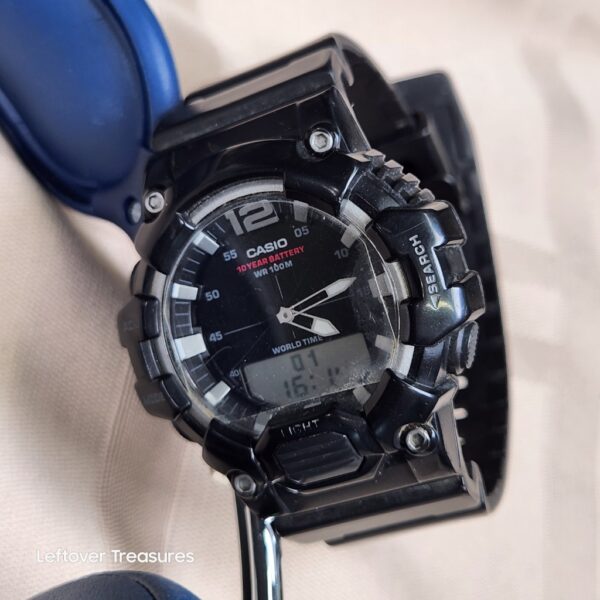 c157- Headphones, no charger. Casio watch - Leftover Treasures